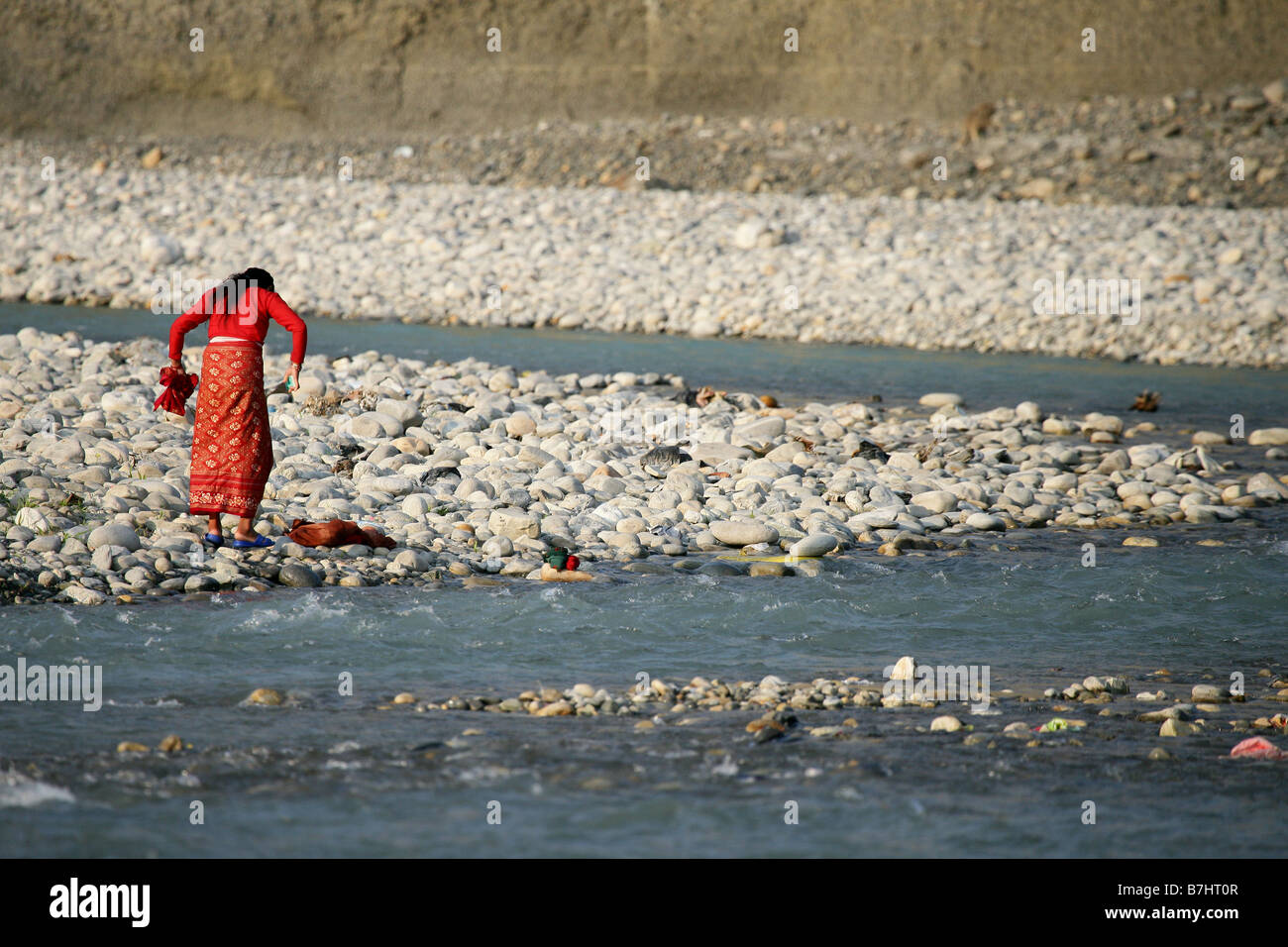 “Lady washing clothes in the River Seti Pokhara” Stock Photo - Alamy