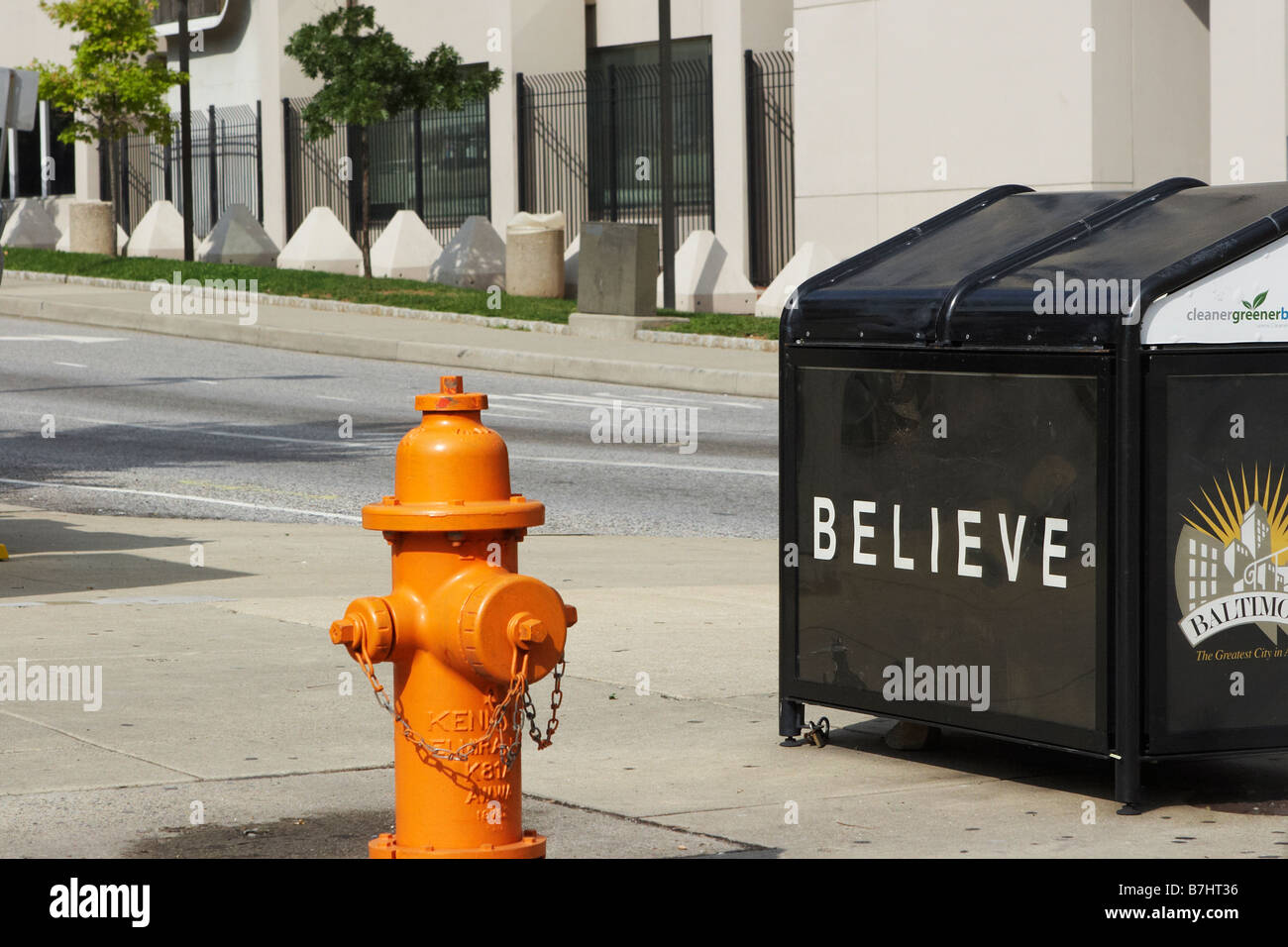 A large trash receptacle with a Believe campaign poster Baltimore ...