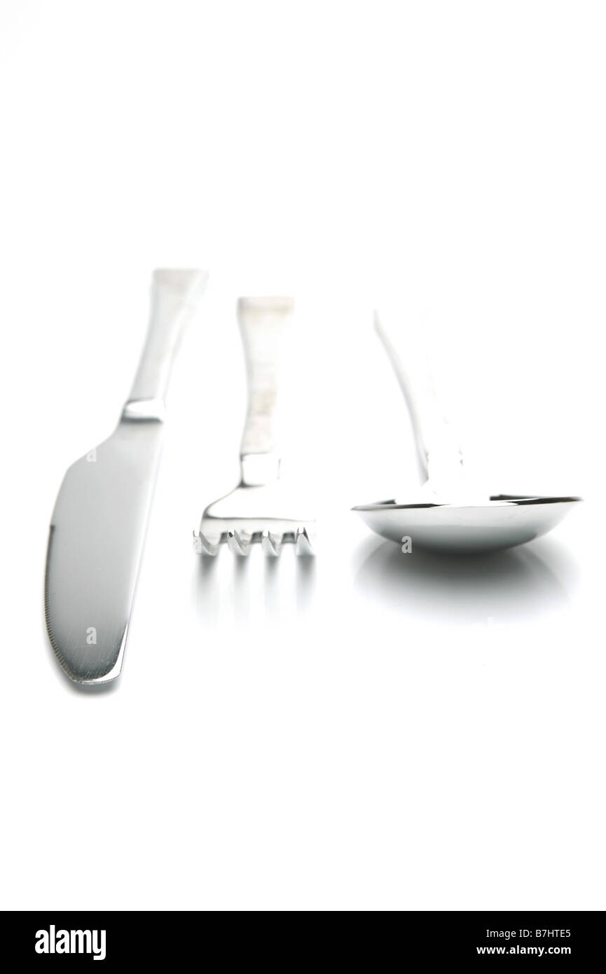 Cutlery isolated against a white background Stock Photo - Alamy