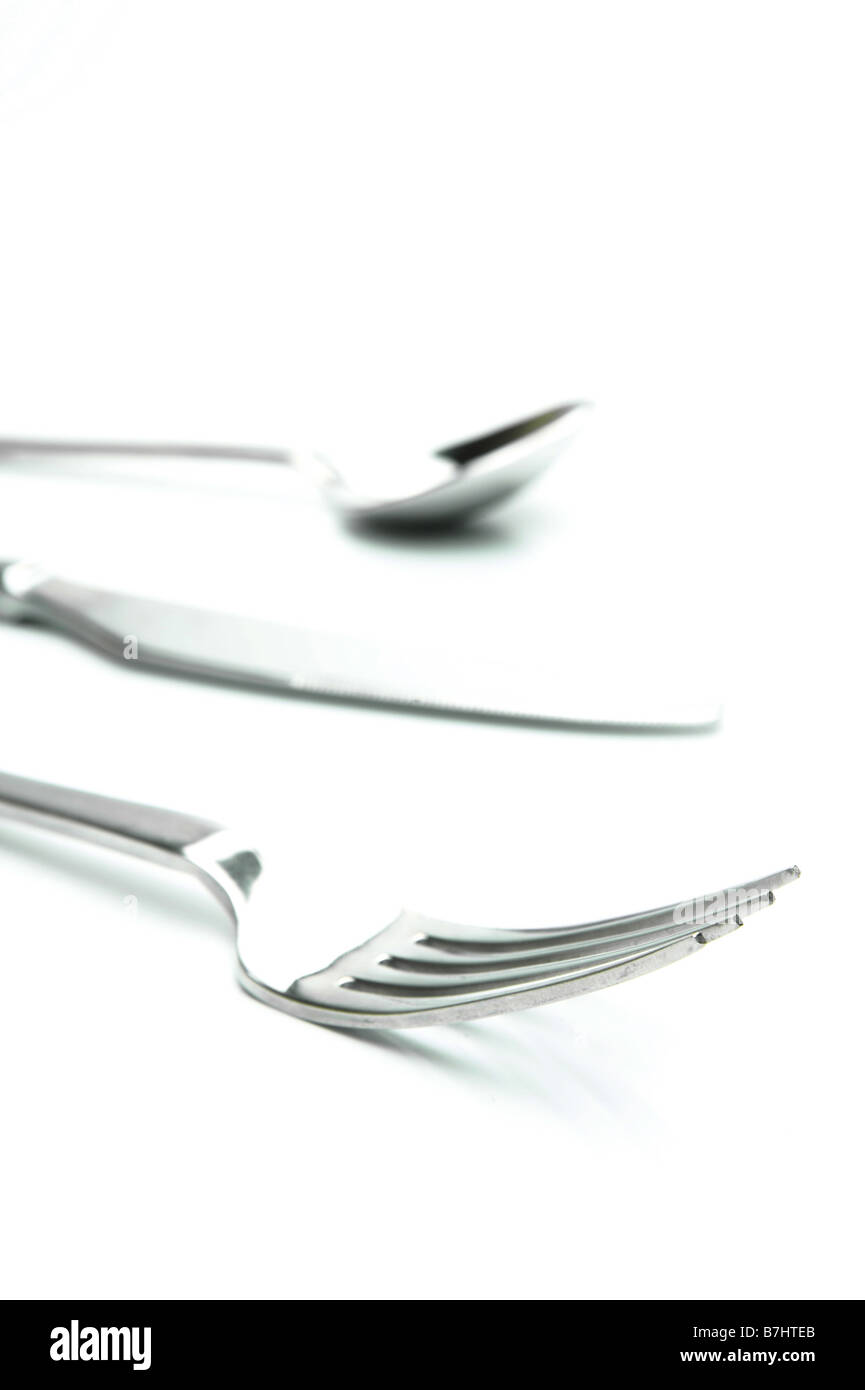Cutlery isolated against a white background Stock Photo - Alamy