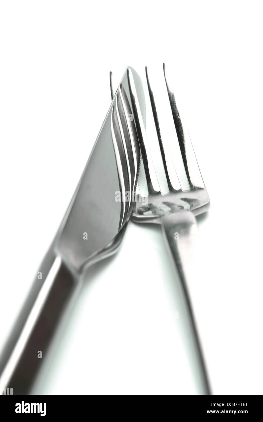Cutlery isolated against a white background Stock Photo - Alamy