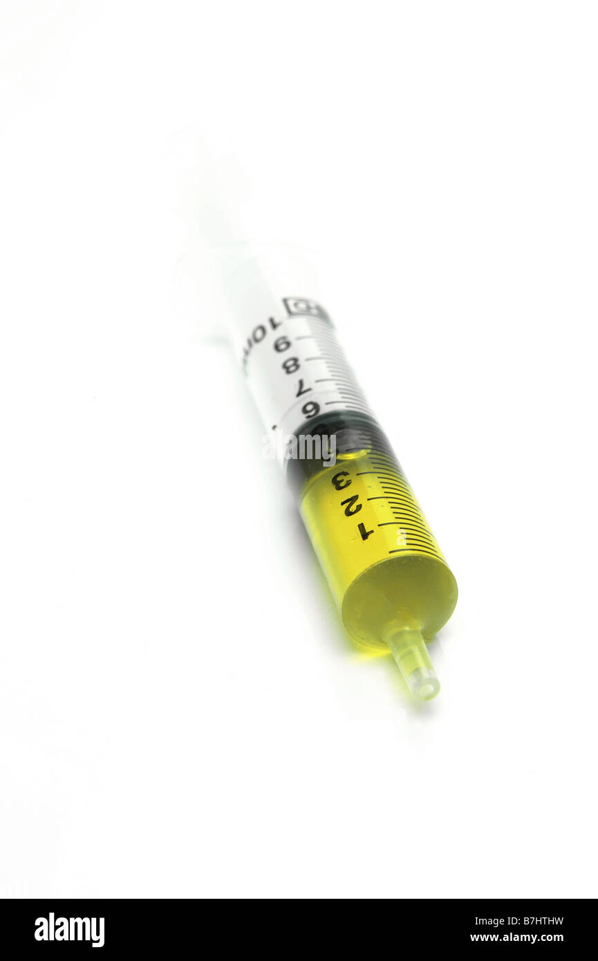 A syringe isolated against a white background Stock Photo - Alamy