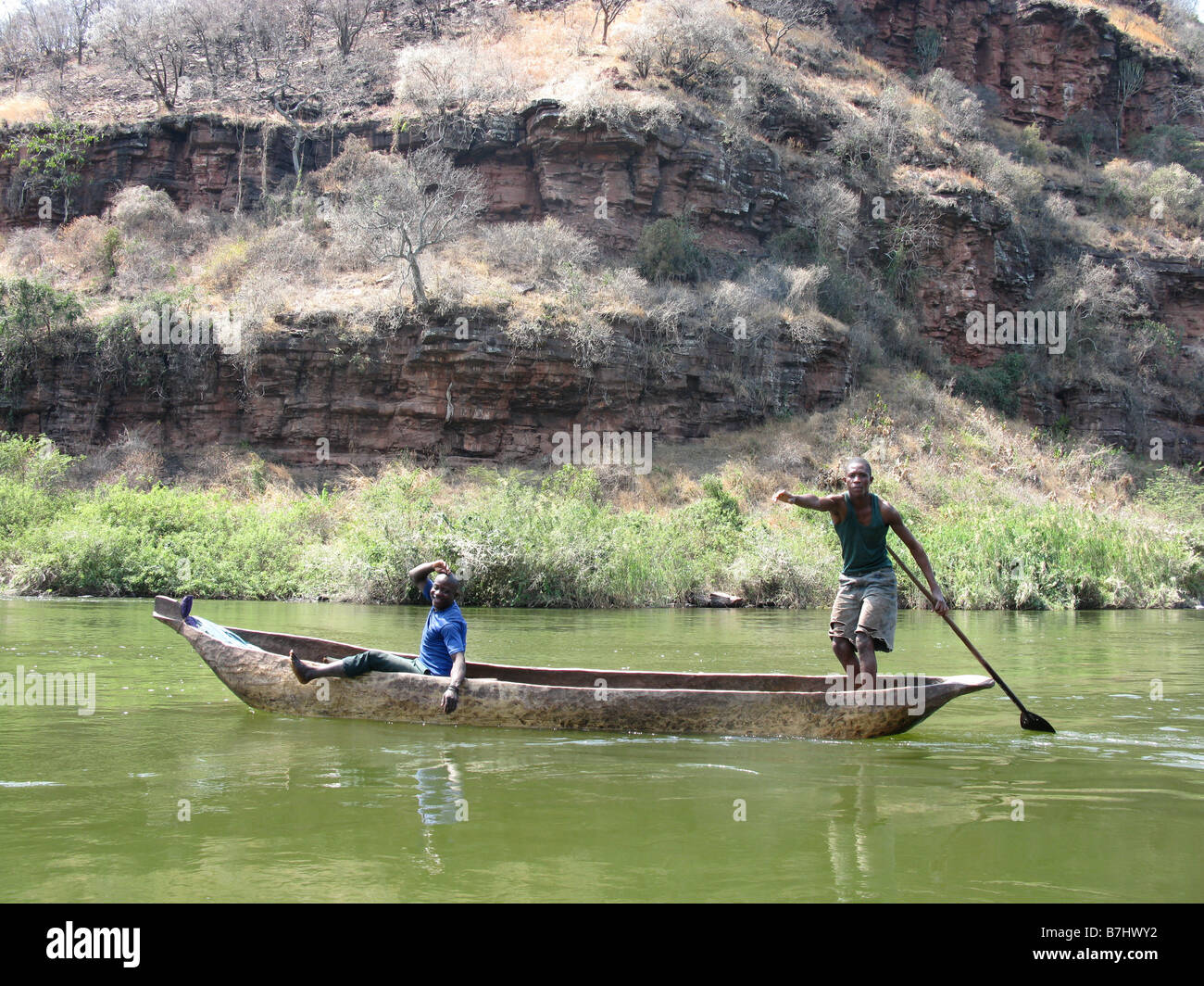 Congolese fishermen in dugout canoe on upper Luvua river canyon below ...