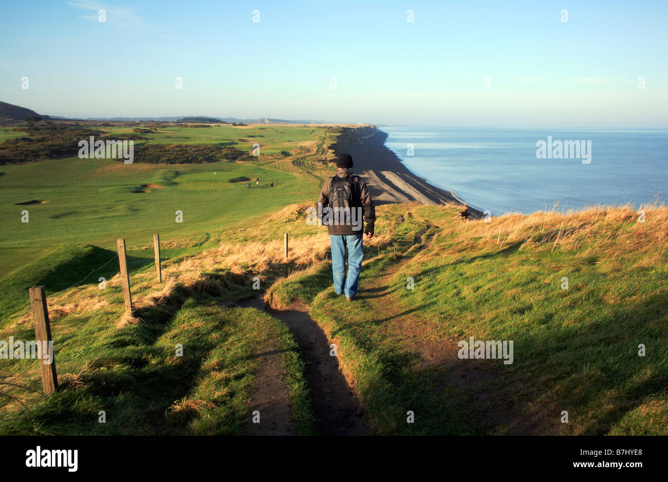 Walker on the Norfolk Coast Path between Sheringham and Weybourne ...