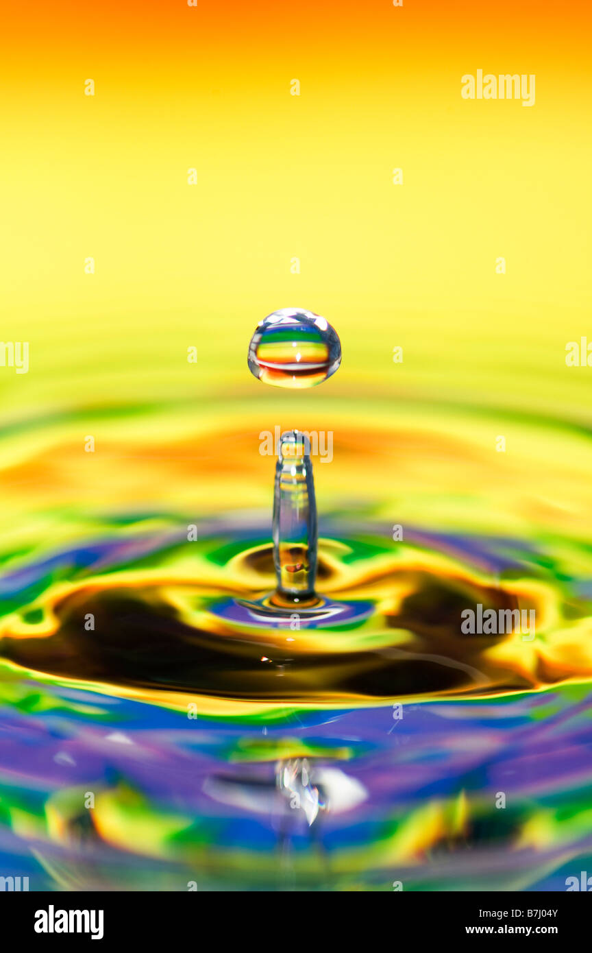 Rainbow coloured water drop and ripple Stock Photo - Alamy