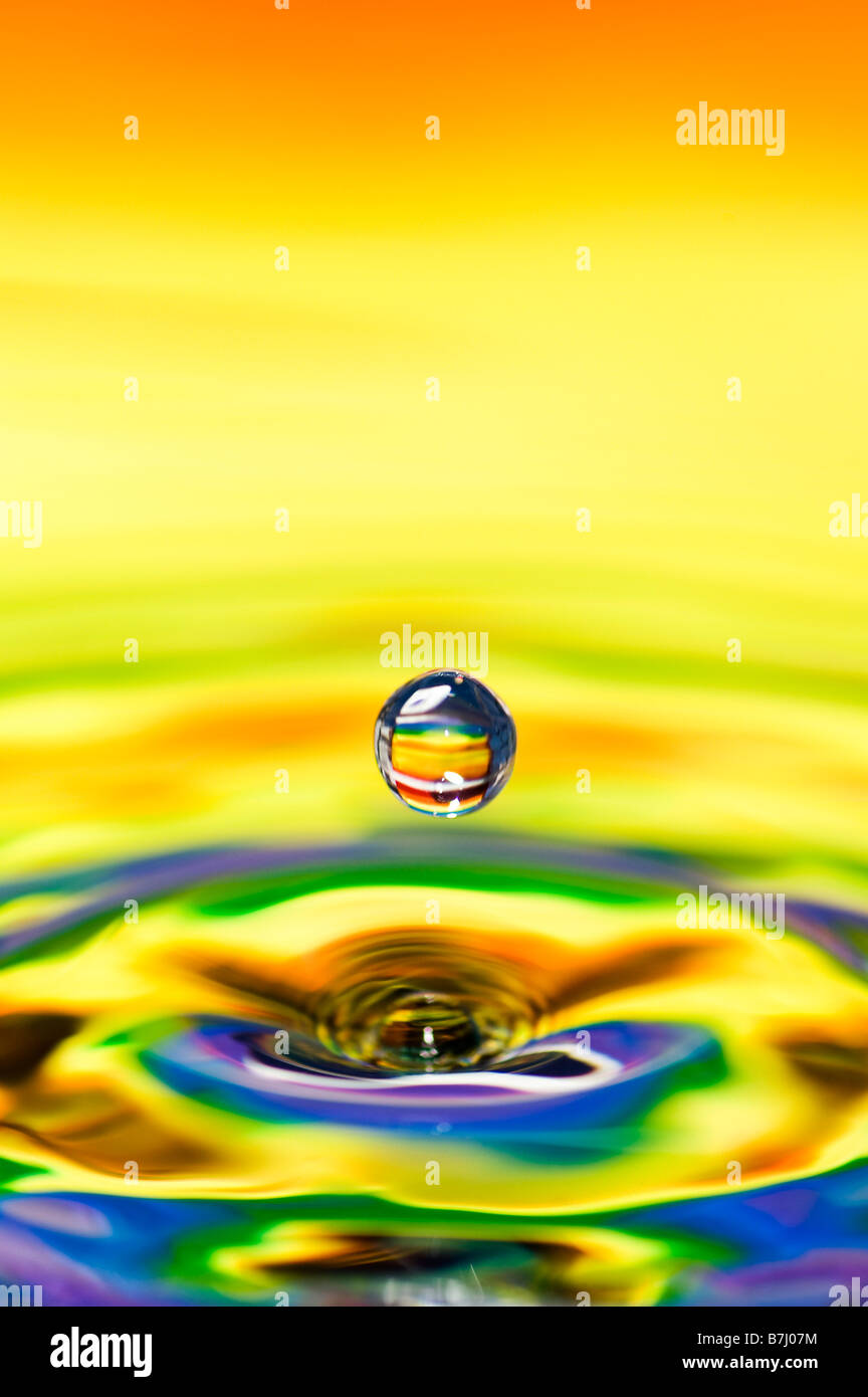 Rainbow coloured water drop and ripple Stock Photo - Alamy