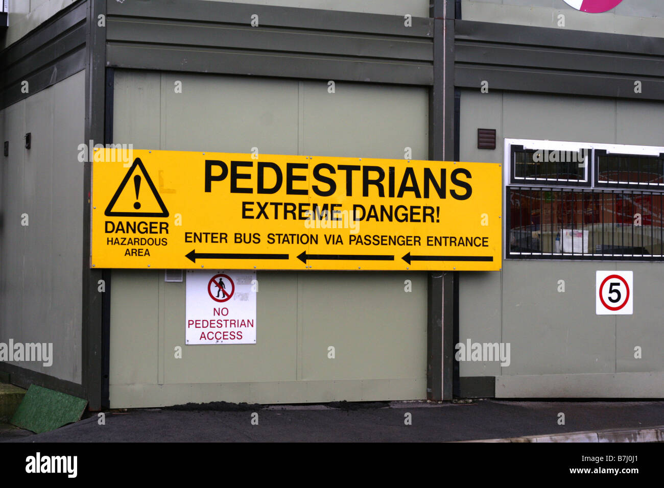 Warning Pedestrians extreme danger sign Stock Photo - Alamy
