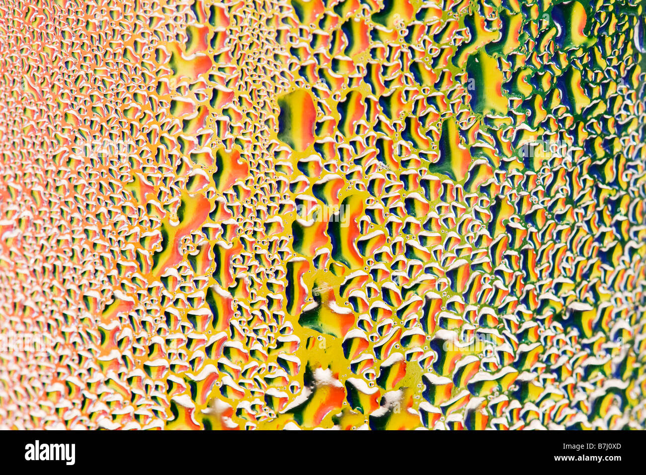 Rainbow coloured condensation water drops pattern Stock Photo - Alamy