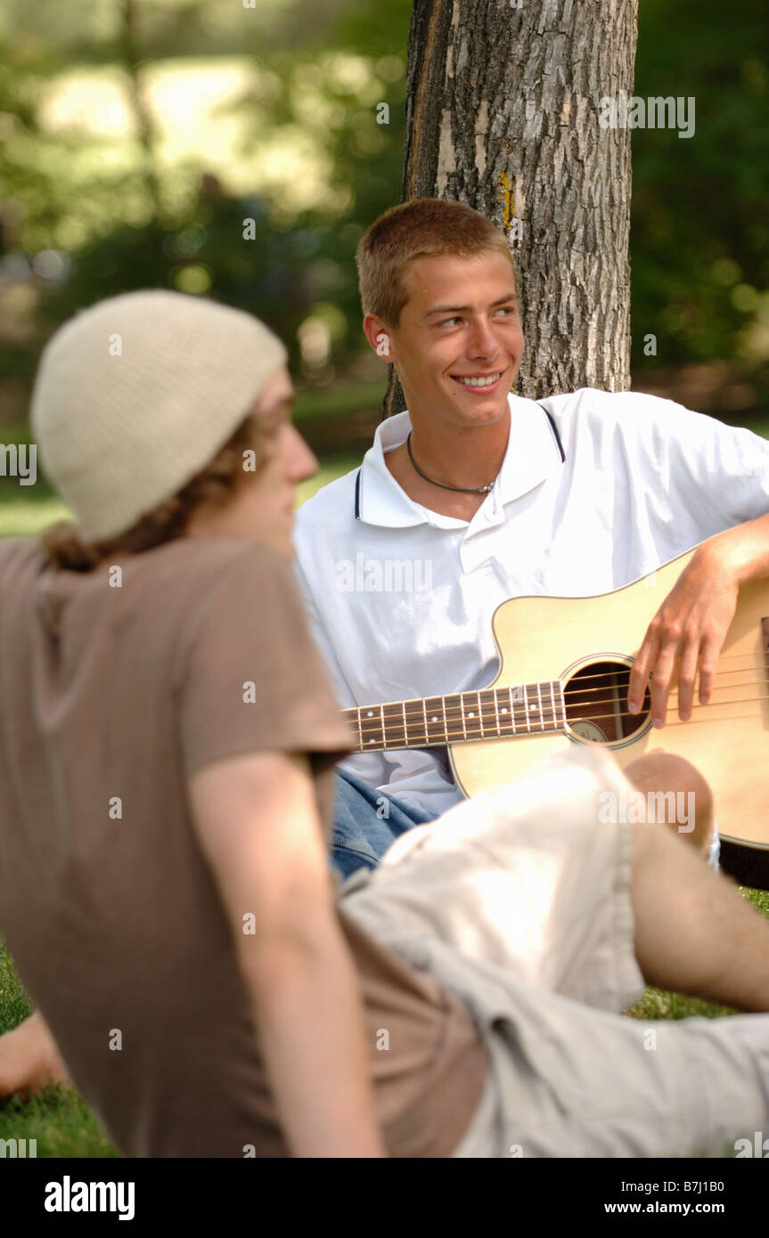 Guys playing guitar hi-res stock photography and images - Alamy