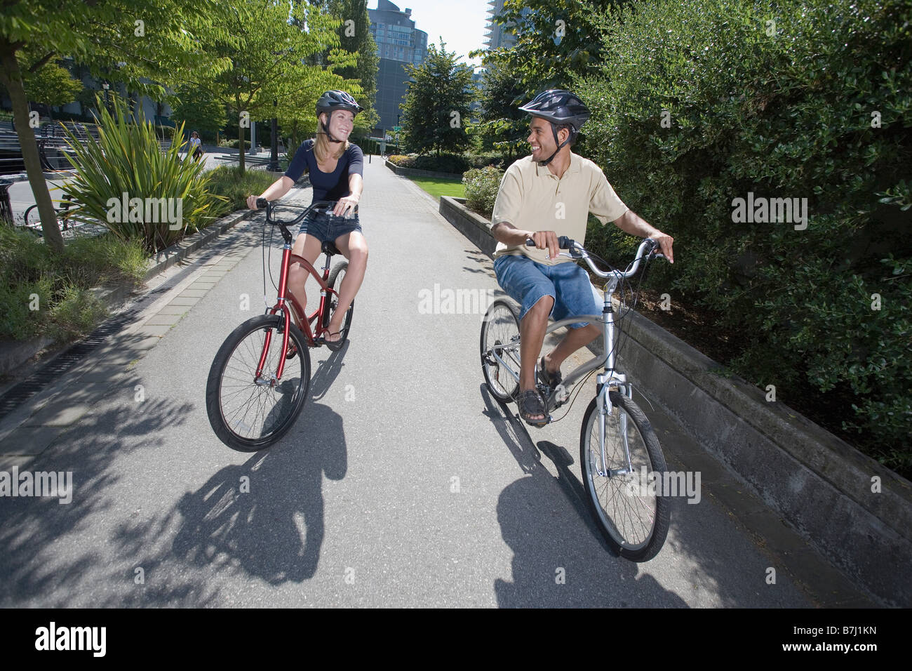 Two men on bicycles helmets hi-res stock photography and images - Alamy