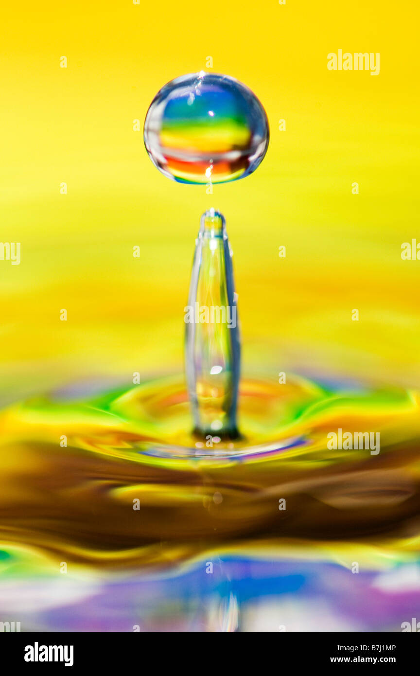 Rainbow coloured water drop and ripple Stock Photo - Alamy
