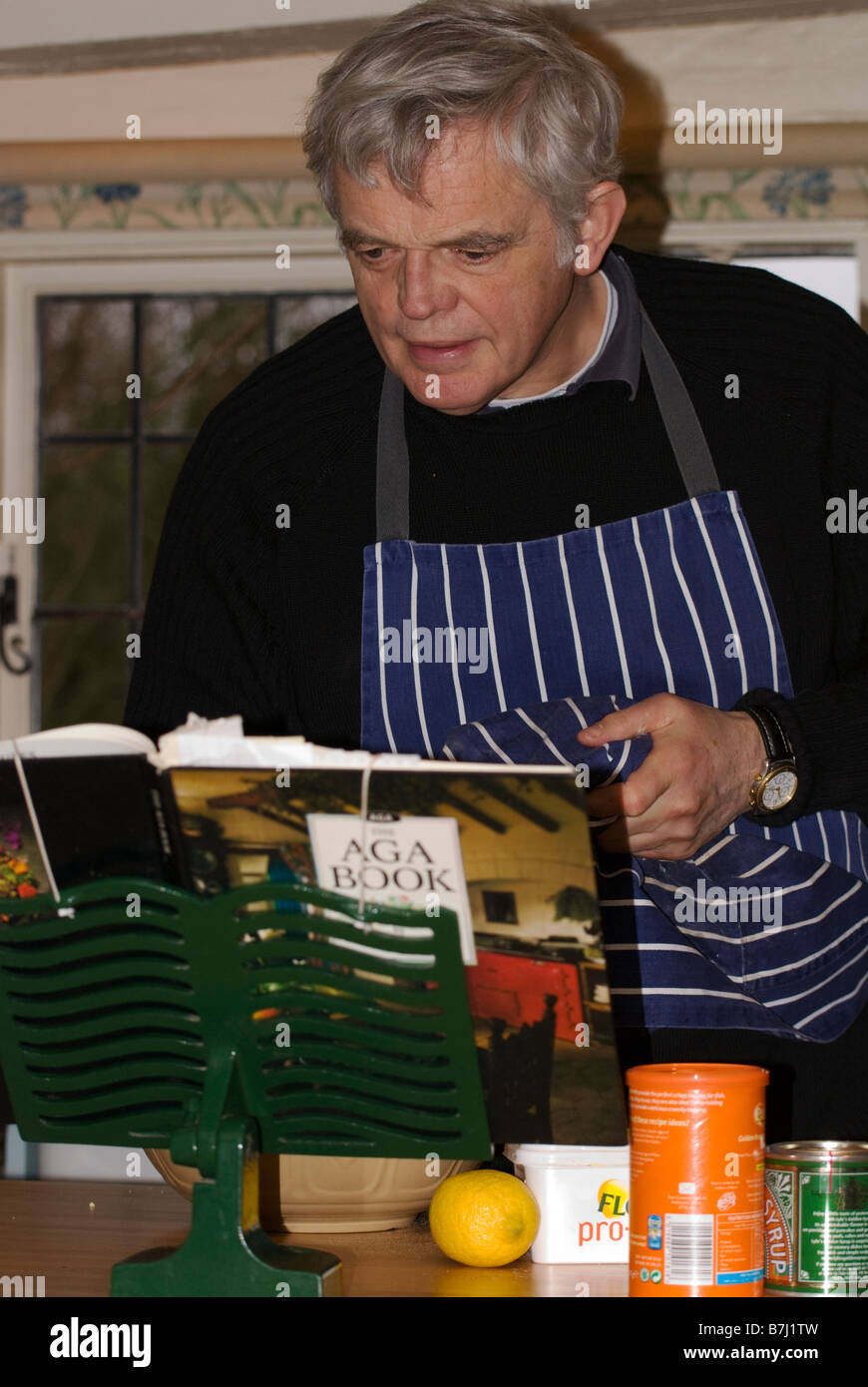 man reading cookbook Stock Photo - Alamy