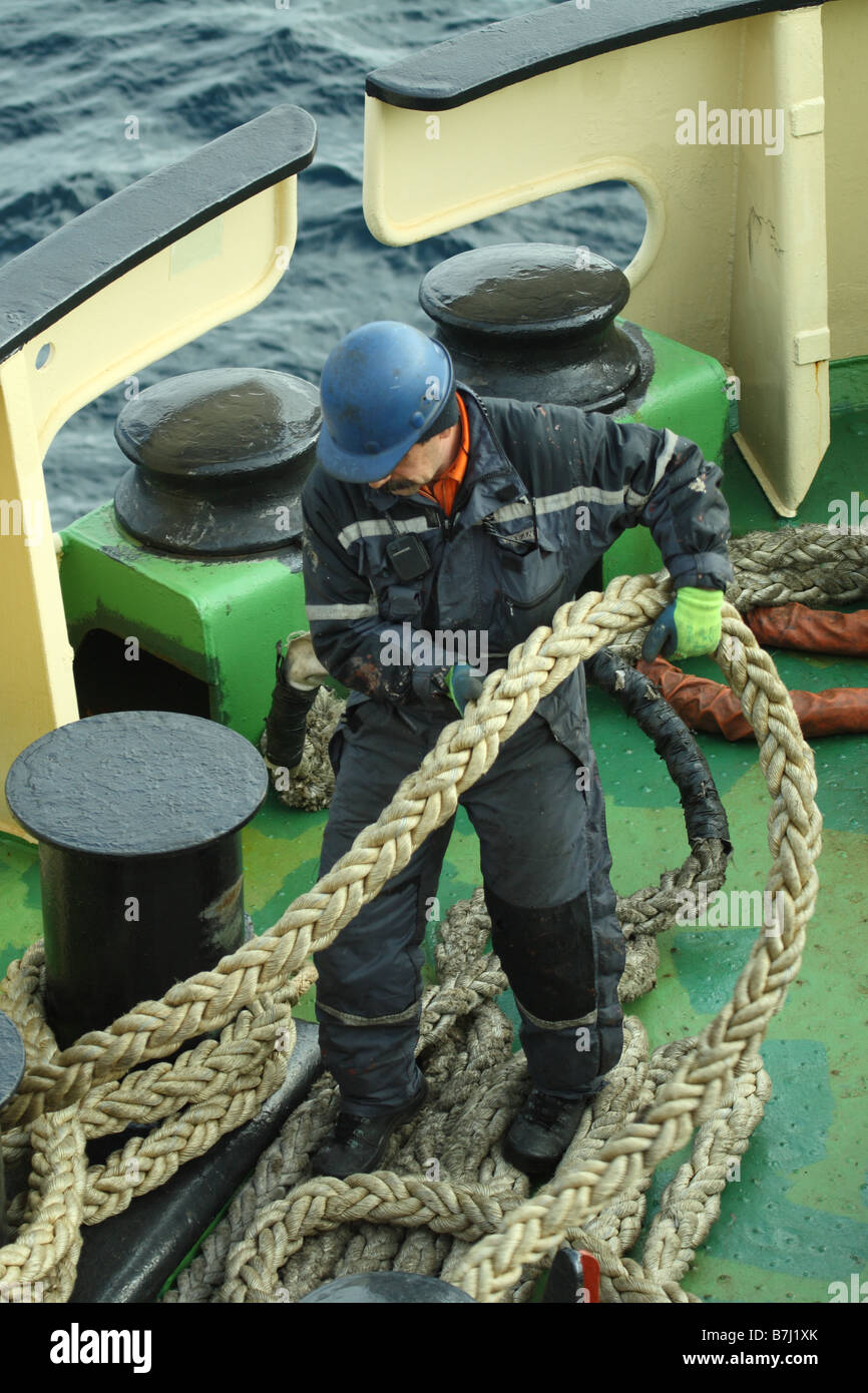 An AB prepares a rope to help land his vessel in Constanta harbour ...