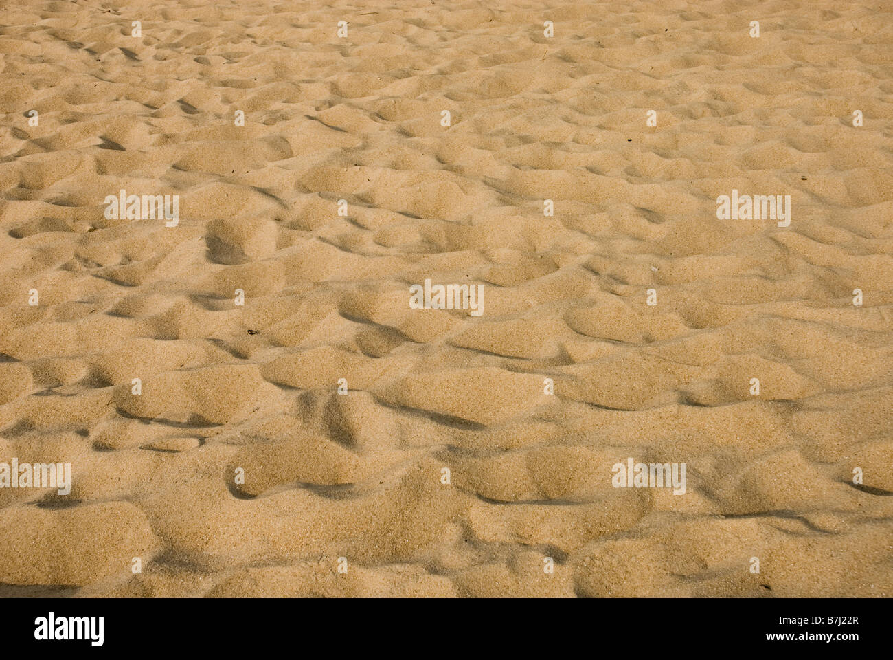 Lots of footprints in sand Stock Photo - Alamy
