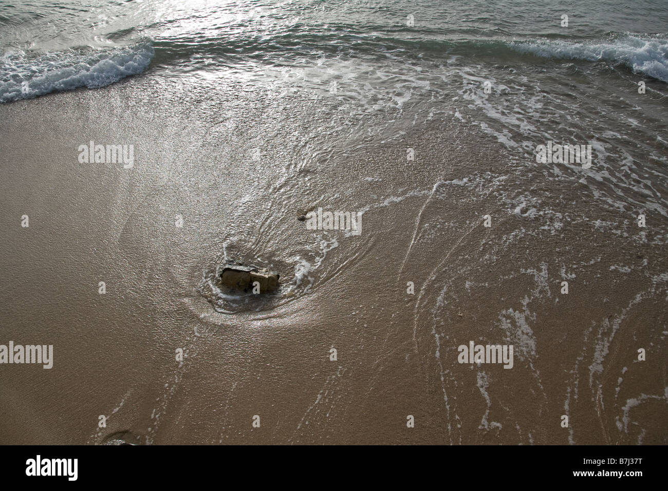 Lapping waves on shoreline of sandy beach hi-res stock photography and ...