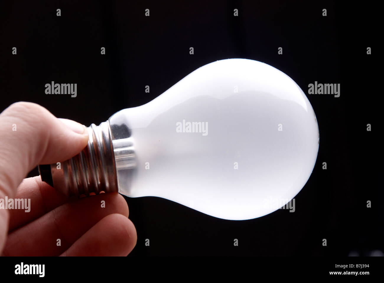 Hand holding a light bulb Stock Photo - Alamy