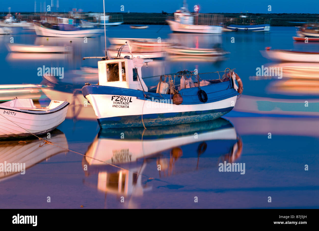 Fishing boats in the evening light at the harbour of Santa Luzia ... Fishing boats in the evening light at the harbour of Santa Luzia ...