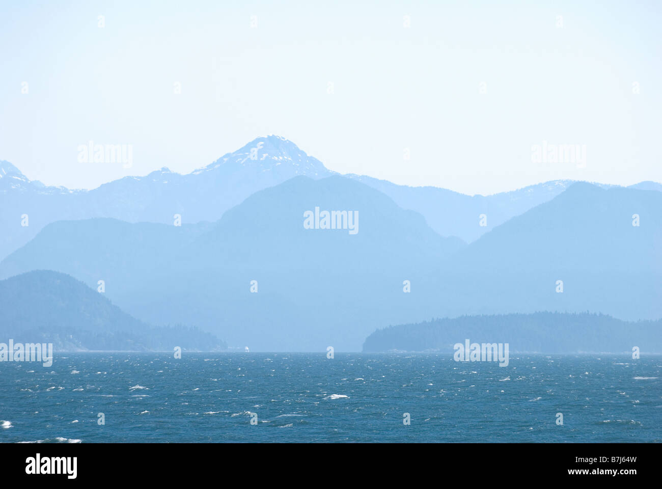 BC's Coast mountains as seen from a BC Ferry in the Strait of Georgia ...