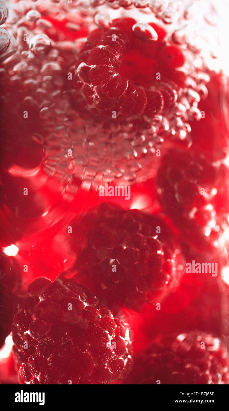 Raspberries floating in water Stock Photo - Alamy