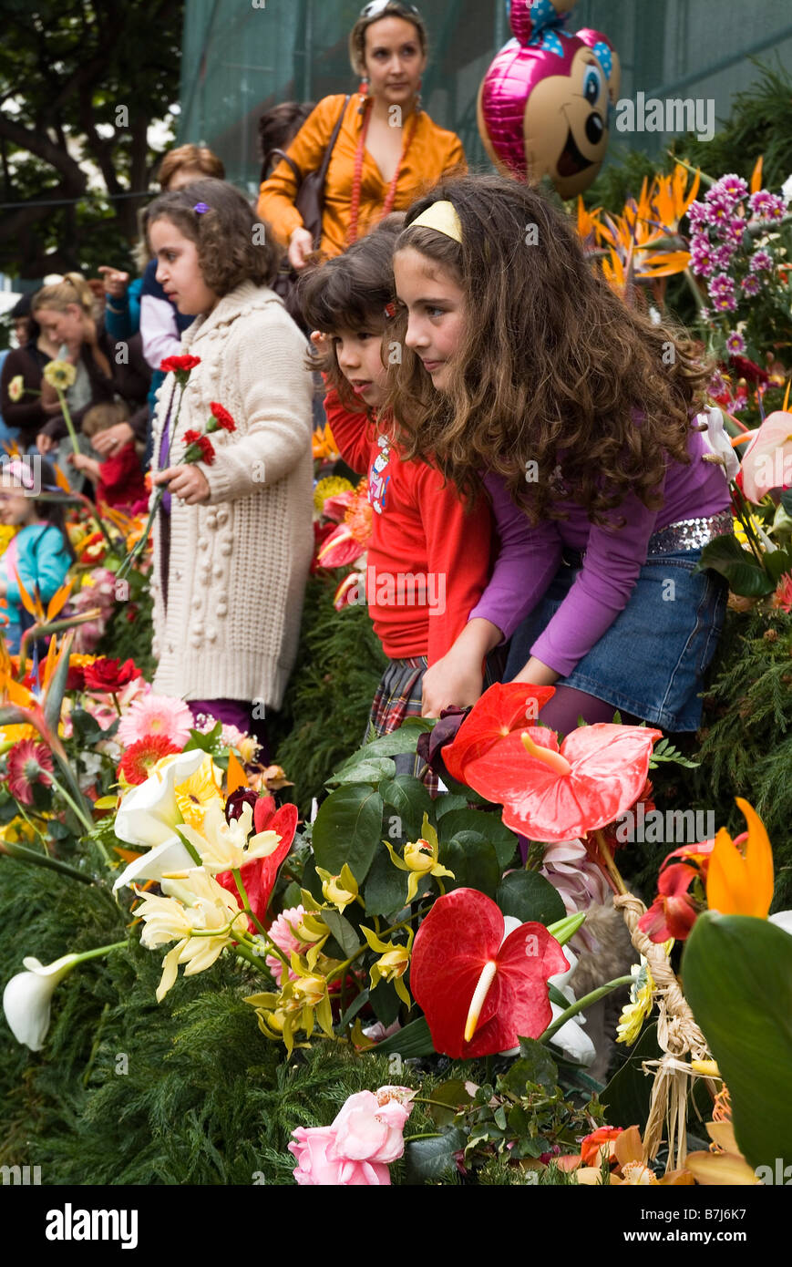 dh Flower Festival FUNCHAL MADEIRA Children on the Wall of Hope placing ...