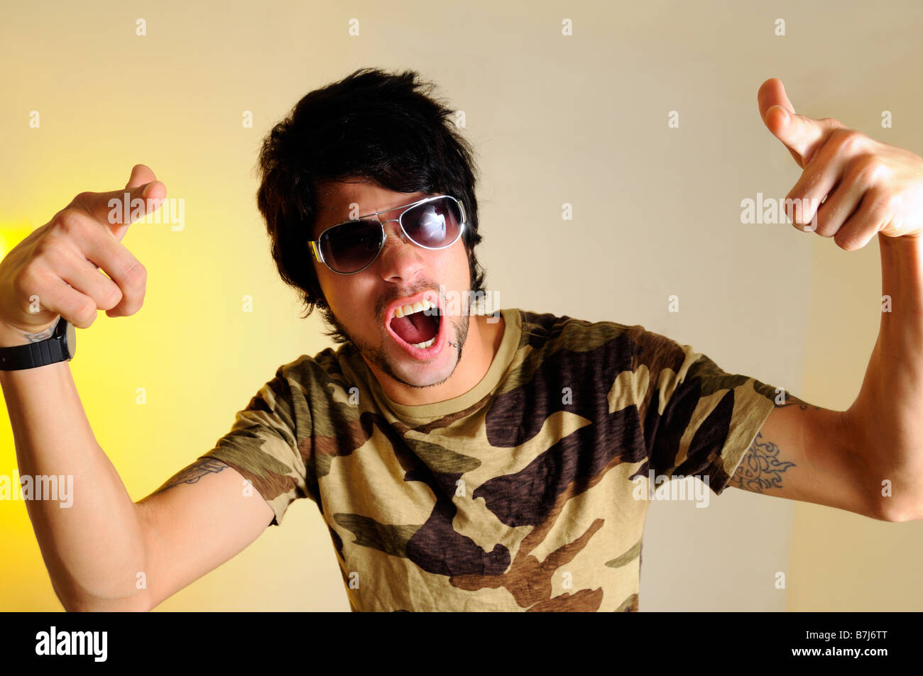 Portrait of crazy young man yelling and gesturing Stock Photo - Alamy