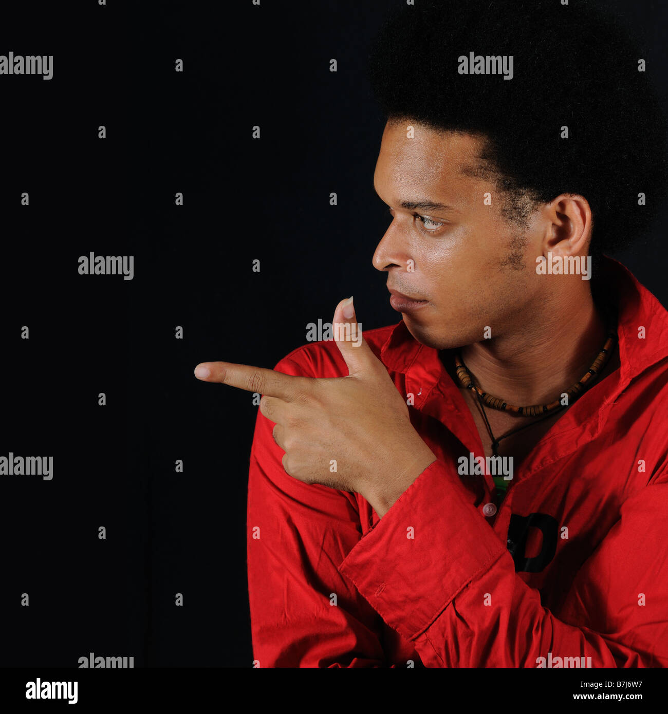 Portrait of young african hispanic man pointing finger - isolated on ...
