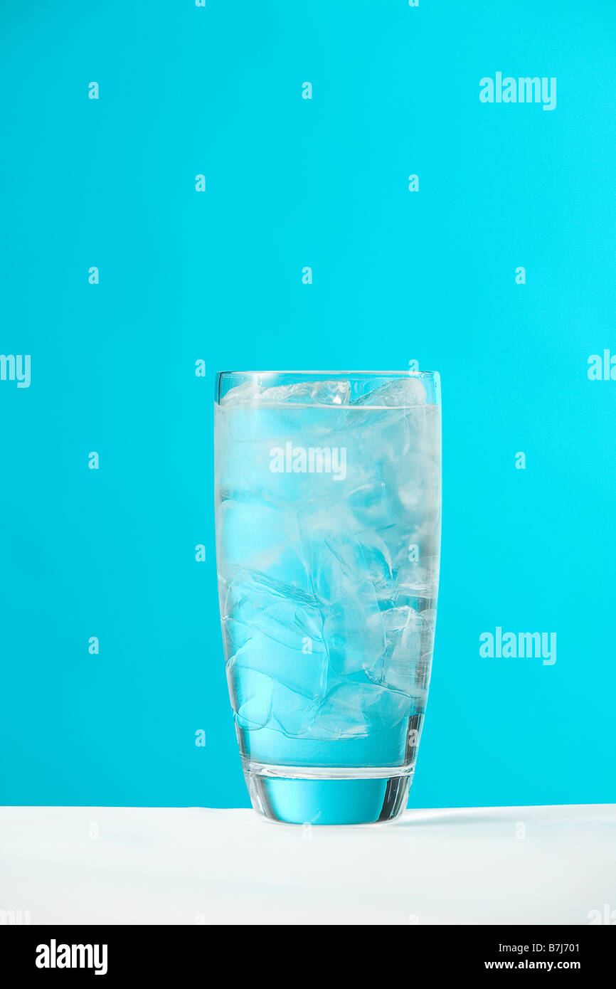 Very full glass of water with ice Stock Photo - Alamy