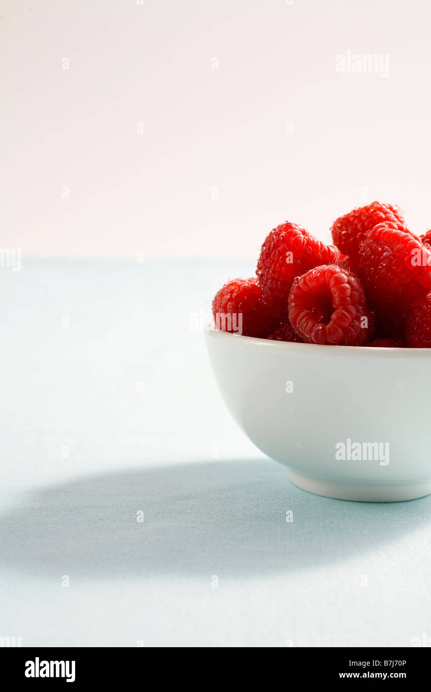 side view, bowl of raspberries Stock Photo - Alamy