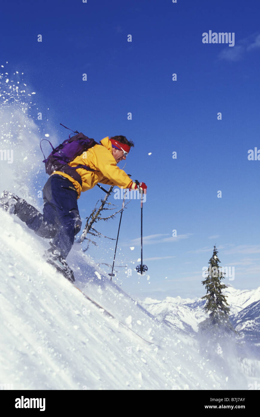 Young man telemarking on steep slope at Fernie Alpine Resort, Fernie ...