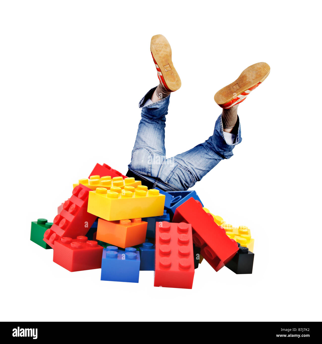Person head first in a pile of Lego bricks Stock Photo - Alamy