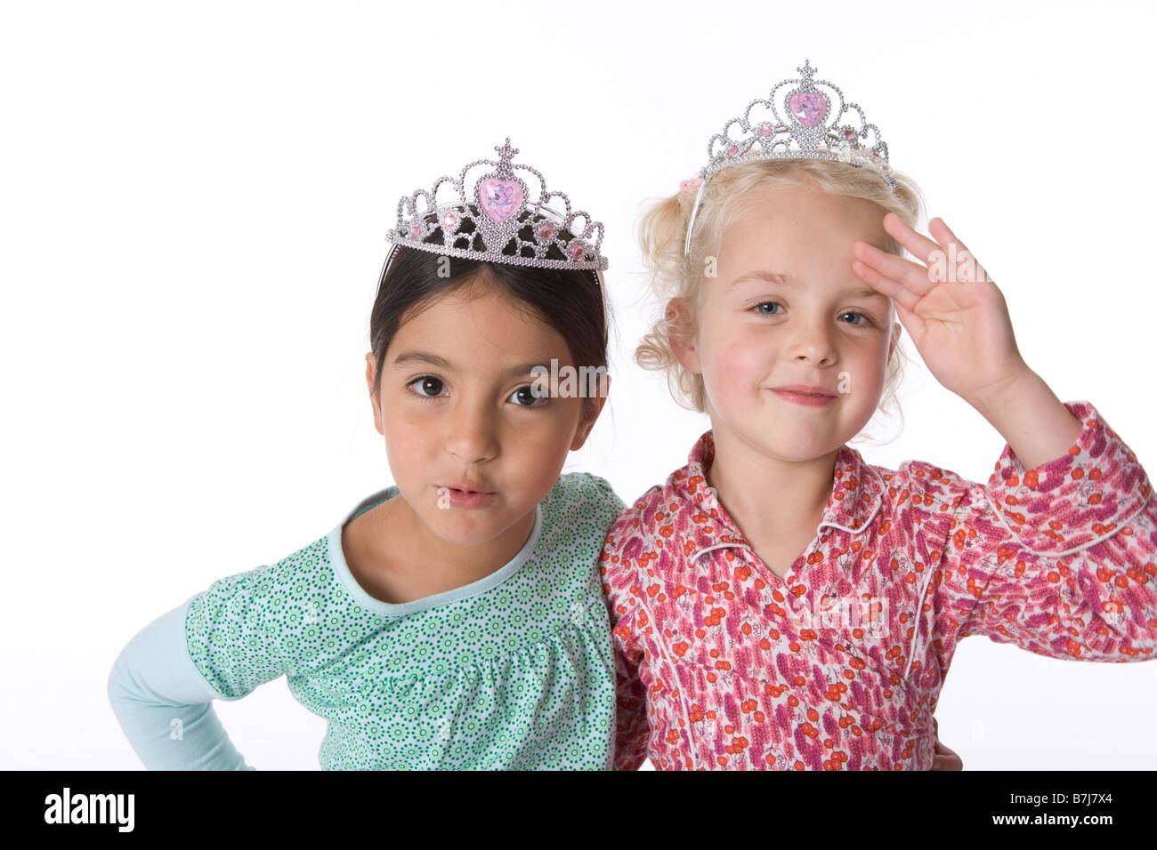 Two girls with a crown making fun Stock Photo - Alamy