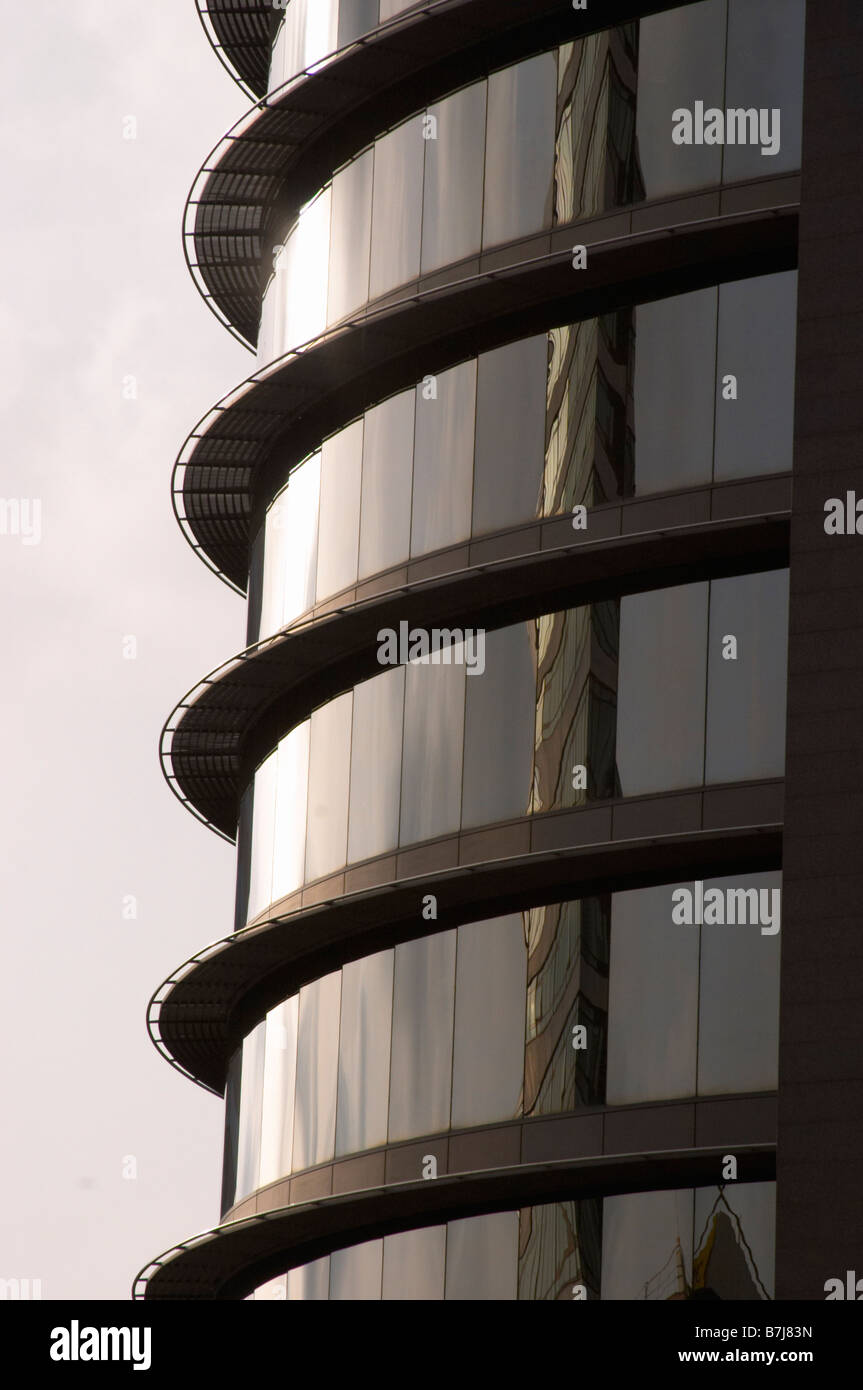 Reflections in curved facade of office building. Barcelona, Catalonia ...