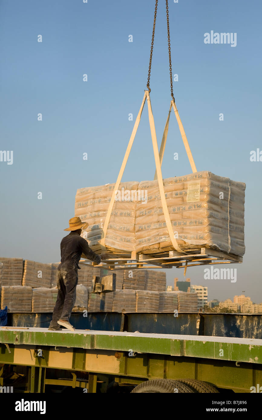 Importing building materials, Workmen Unloading pallets of Iranian ...