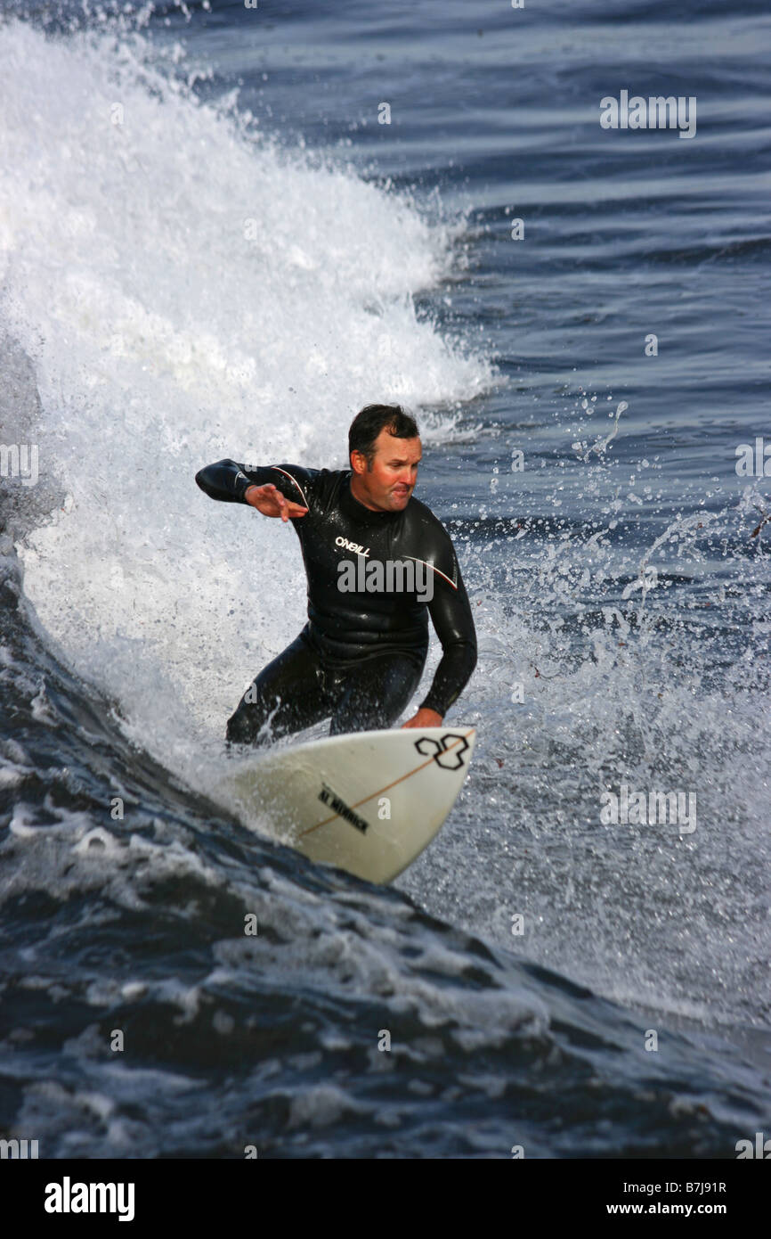 Surfer on a right wave at San Diego Peer, California (USA Stock Photo ...