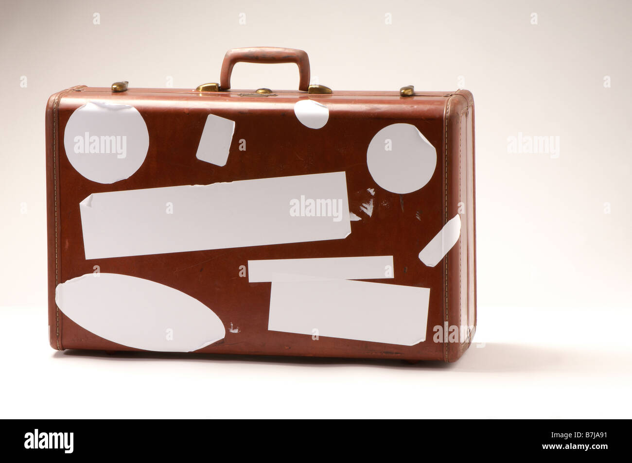 Leather suitcase and labels hi-res stock photography and images - Alamy