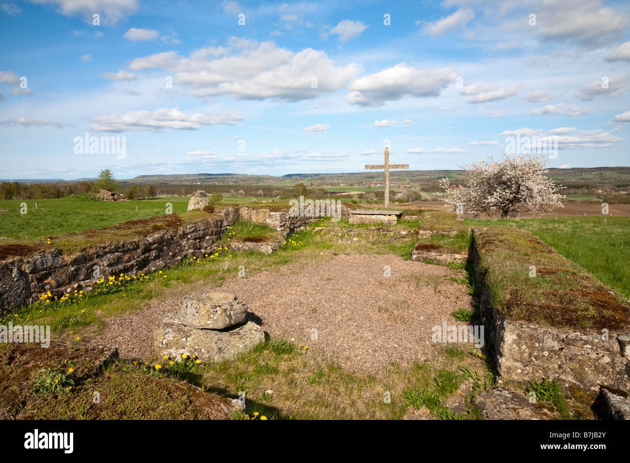 Old church ruin and a crucifix in a beautiful spring landscape Stock ...