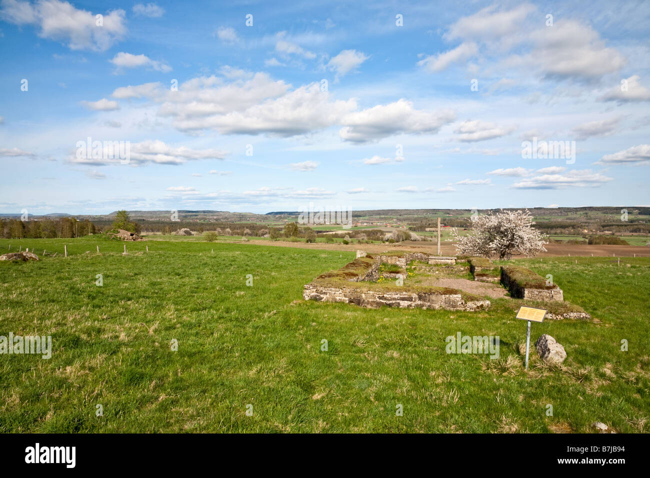 Old church ruin and a crucifix in a beautiful spring landscape Stock ...