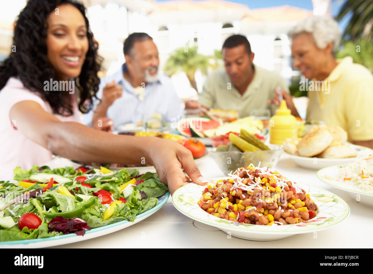 Family Eating An Al Fresco Meal Stock Photo - Alamy