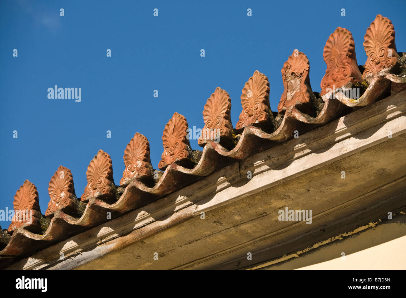 Terracotta antefixes or antefixae on the roofline of a neo classical ...