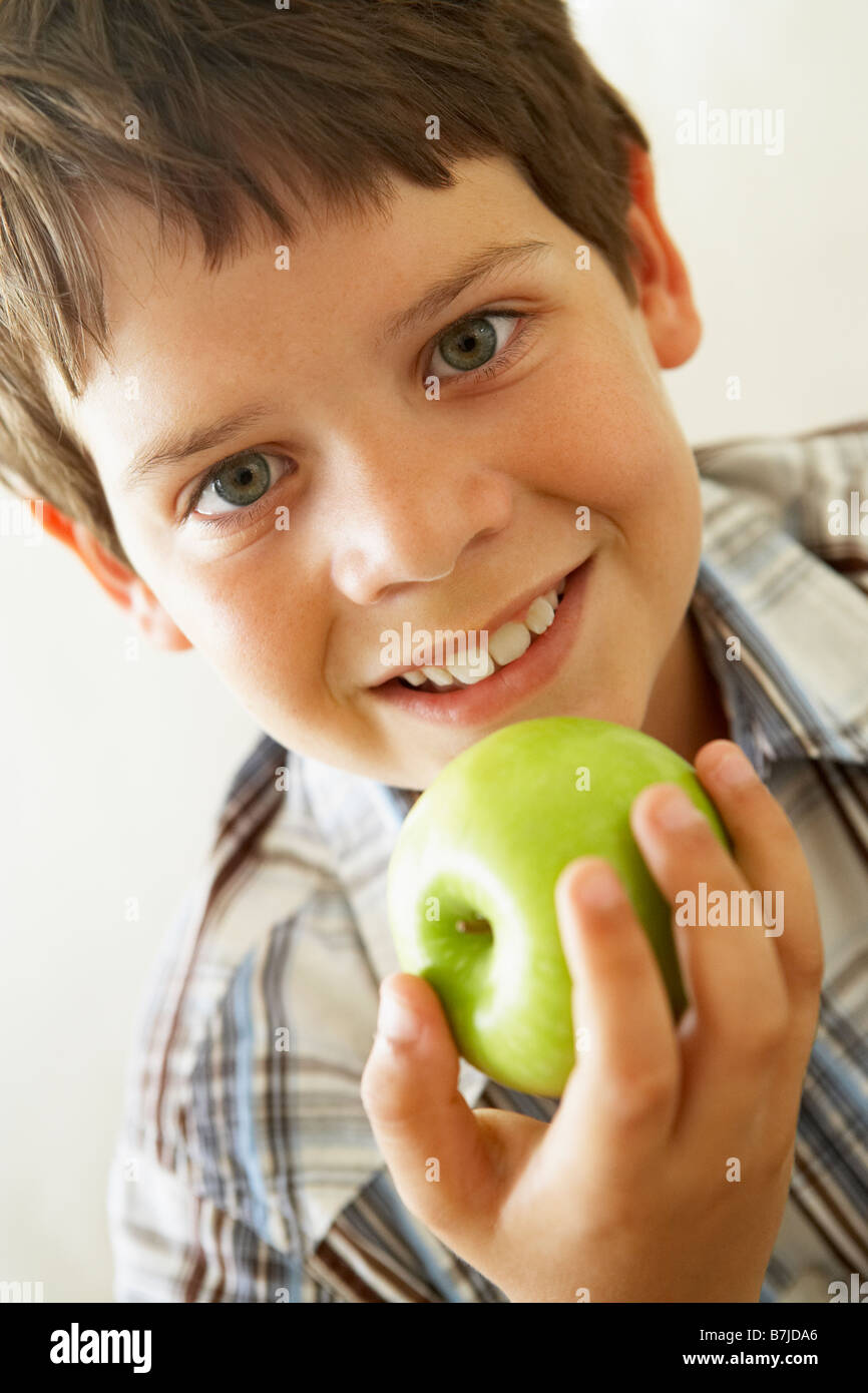 Young Boy Eating Apple Stock Photo - Alamy