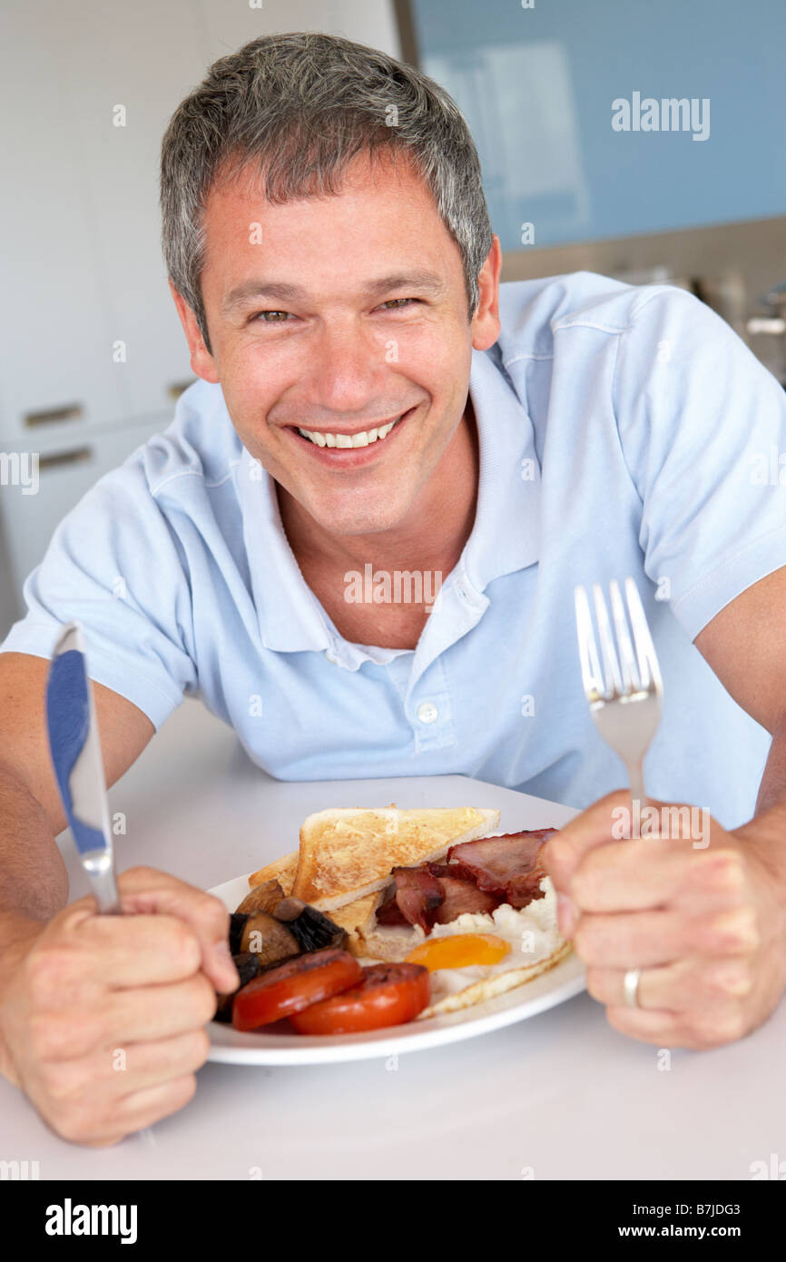 Middle Aged Man Eating Unhealthy Fried Breakfast Stock Photo - Alamy Middle Aged Man Eating Unhealthy Fried Breakfast Stock Photo - Alamy