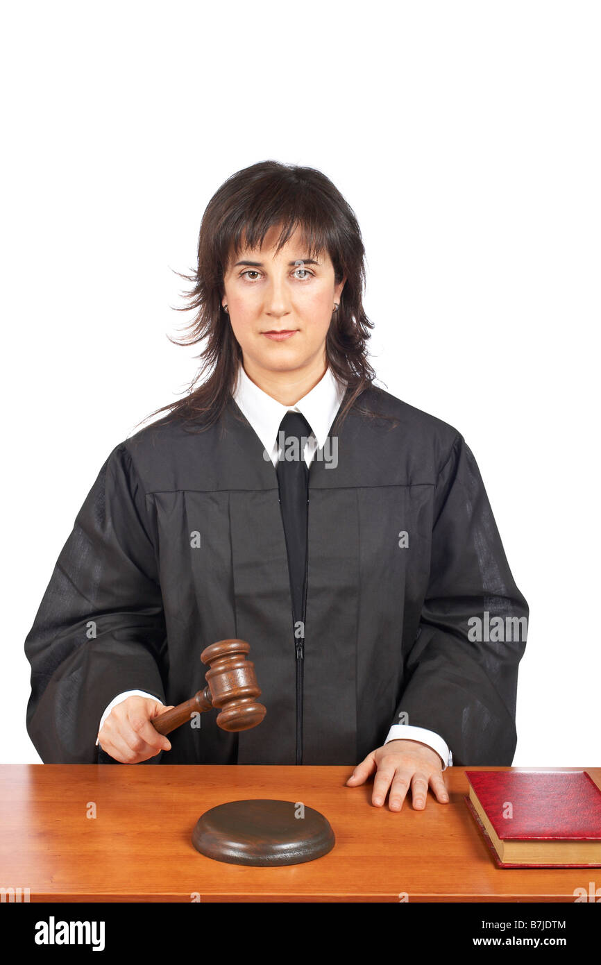 A female judge in a courtroom striking the gavel Shallow depth of field ...