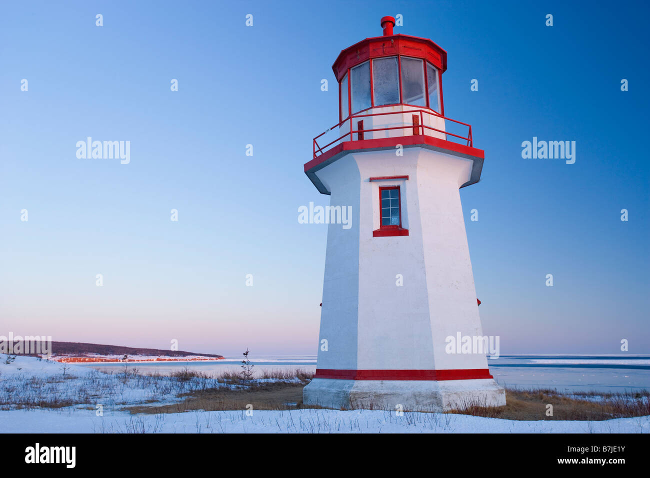 View of Cap Blanc lighthouse and ÃŽle Bonaventure at sunset, Quebec ...