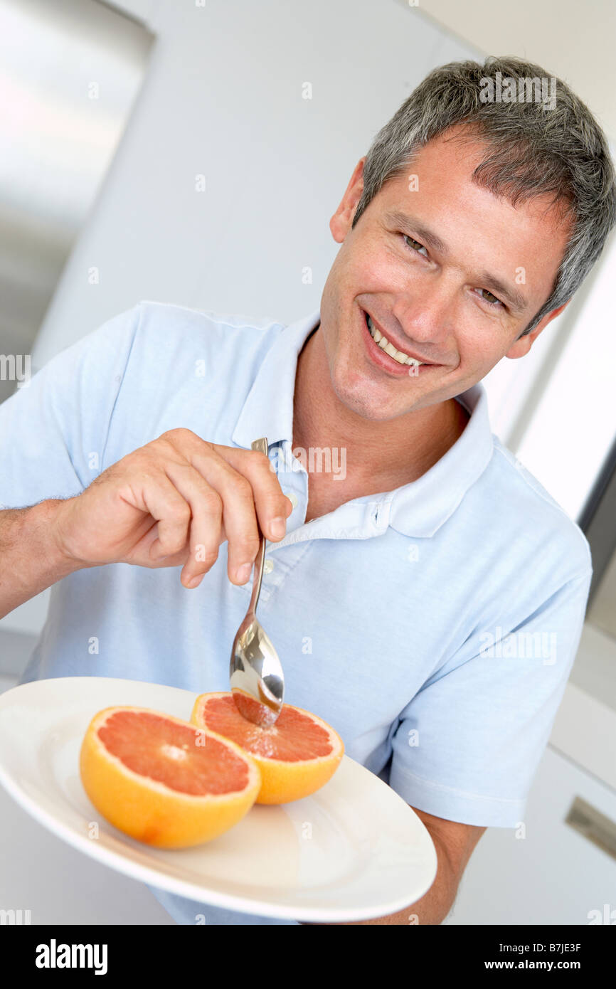 Man eating grapefruit hi-res stock photography and images - Alamy