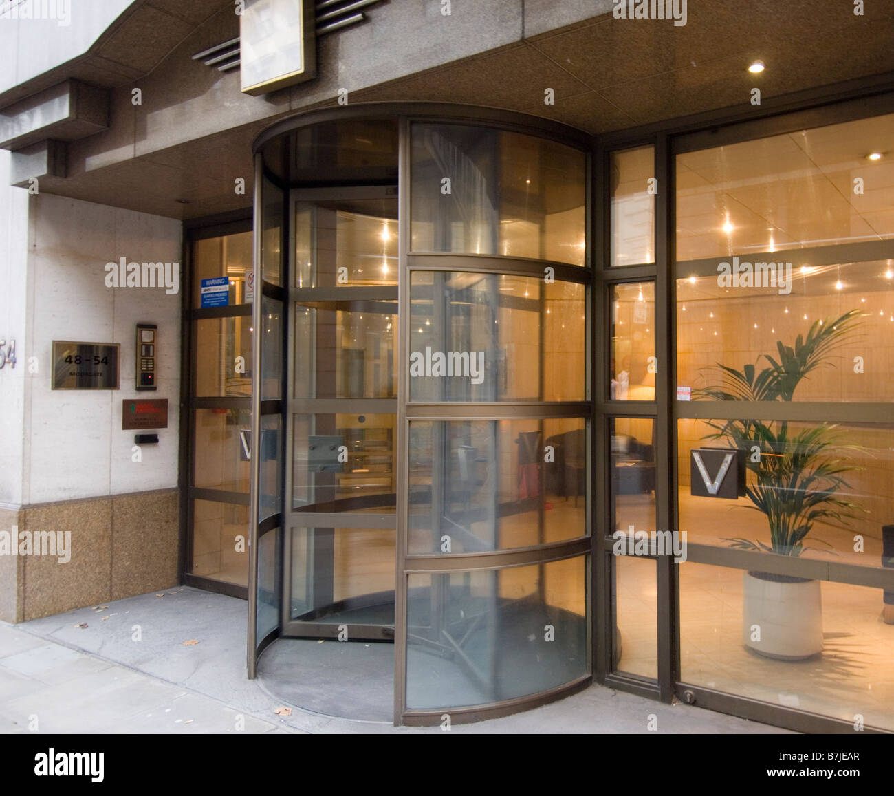 Revolving Doors to Office Block, London Stock Photo - Alamy