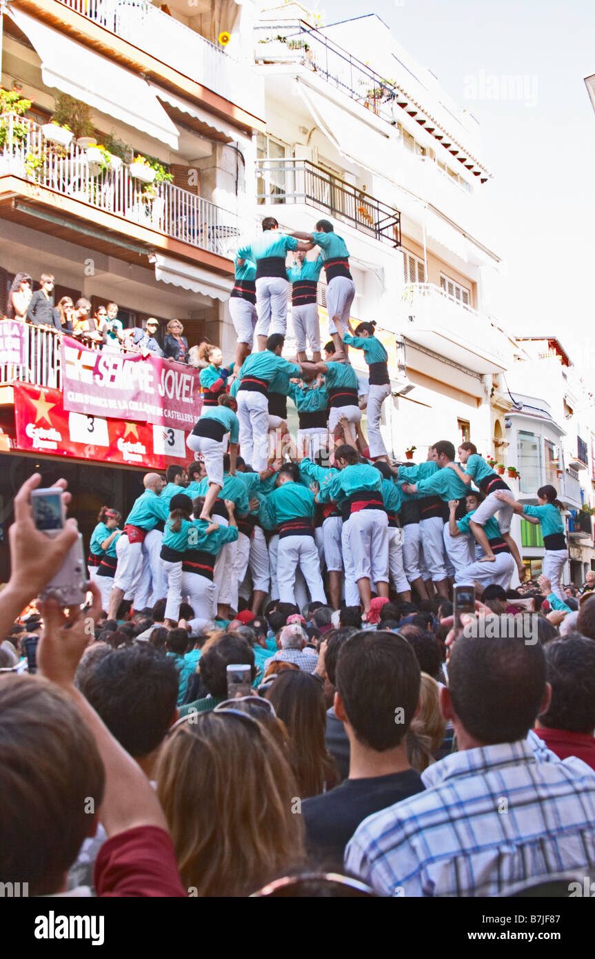 Human tower competition, castellers, Climbing up. Drawing big crowds ...