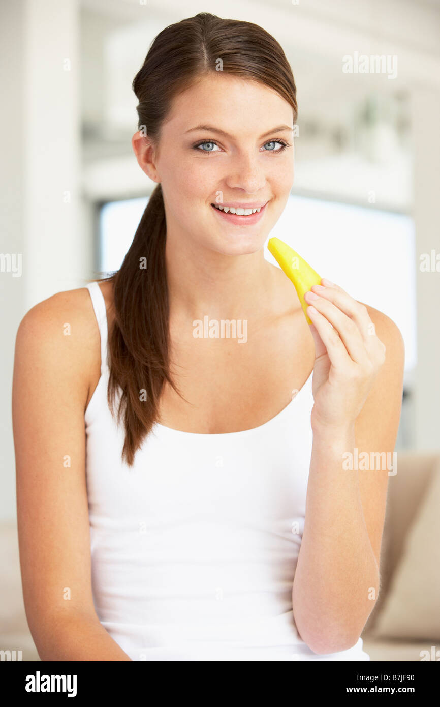 Young Woman Eating Fresh Pineapple Stock Photo - Alamy