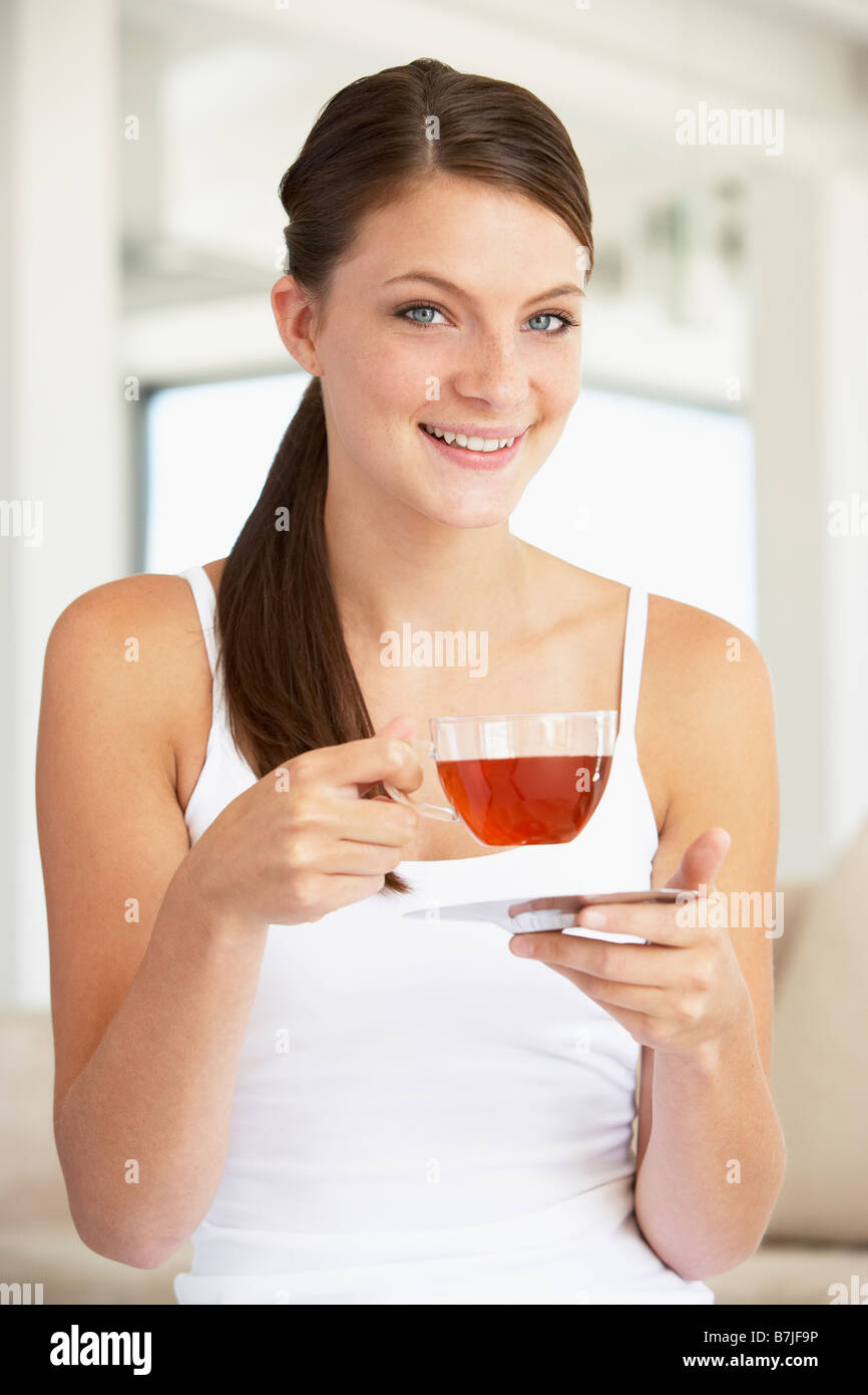 Young Woman Drinking Herbal Tea Stock Photo - Alamy