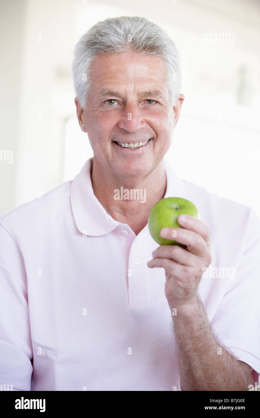 Older man eating apple hi-res stock photography and images - Alamy