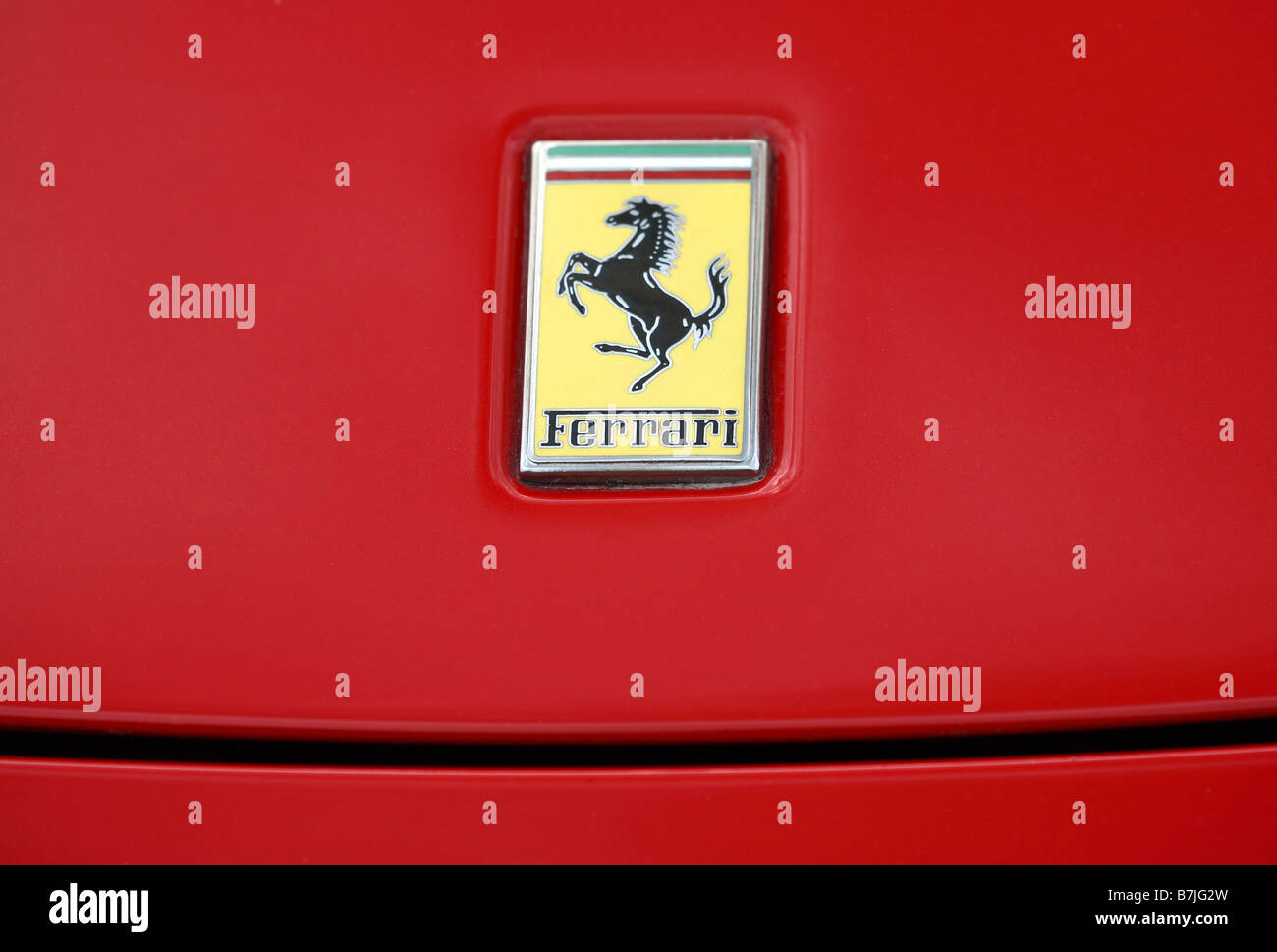 Ferrari bonnet badge on red car Stock Photo - Alamy
